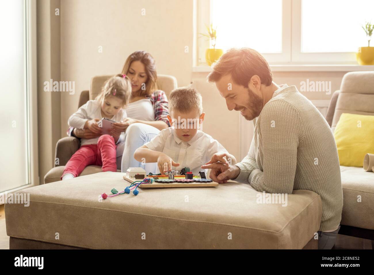 Family mother father son reading hi-res stock photography and images ...