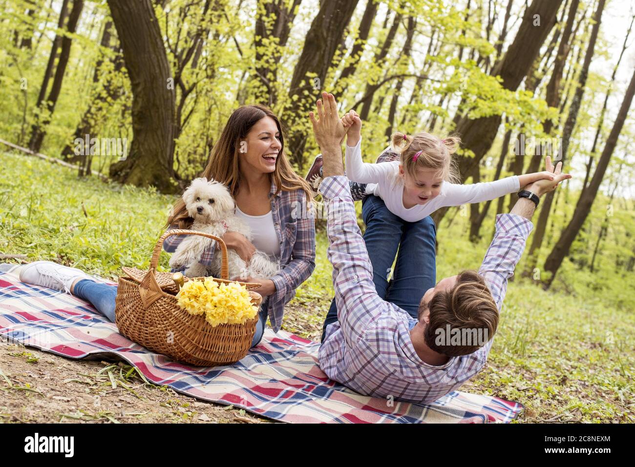 Shallow focus shot of a happy family having a picnic in a forest Stock ...