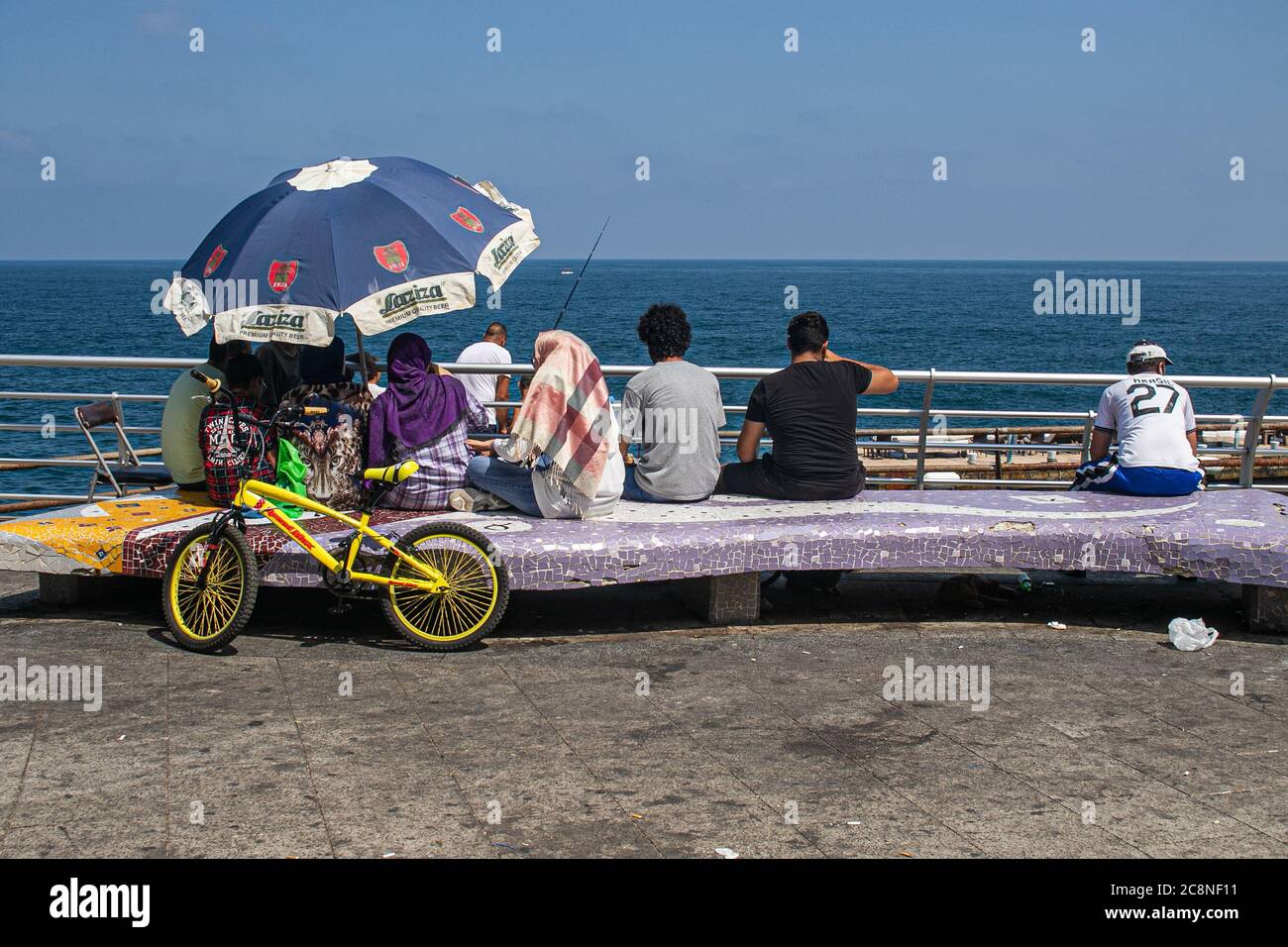 BEIRUT LEBANON. 26 July, 2020. People shelter under parasols on Beirut ...