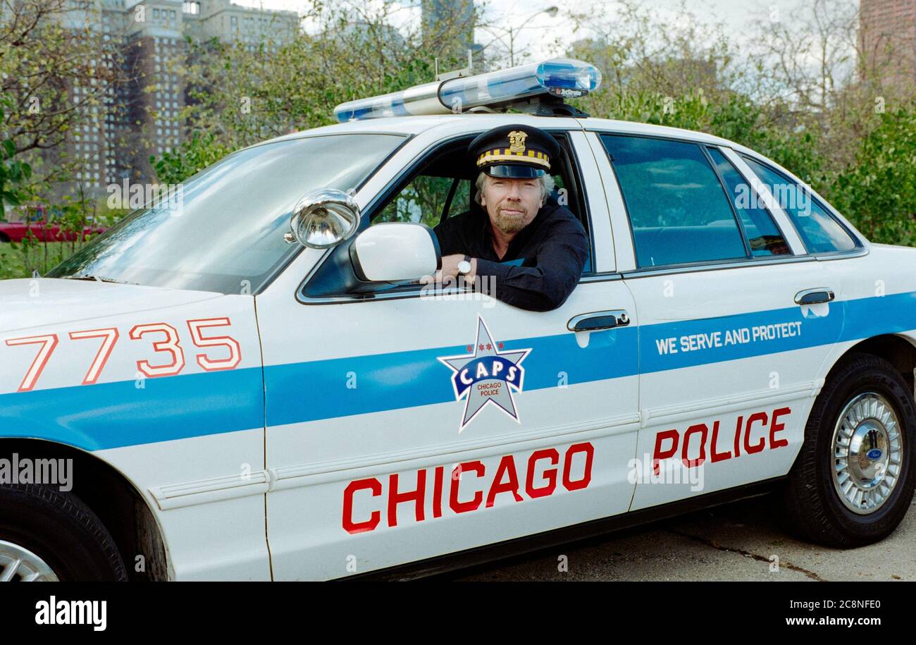 Sir Richard Branson posing in a Chicago state police vehicle in ...