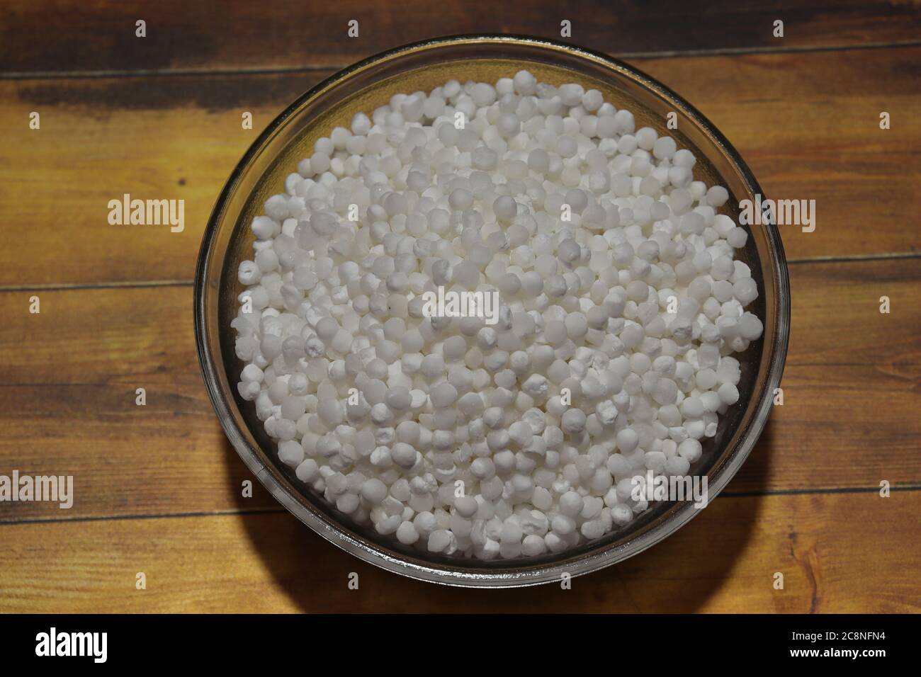 White sago pearls or sabudana Raw healthy sago balls isolated in wooden ...