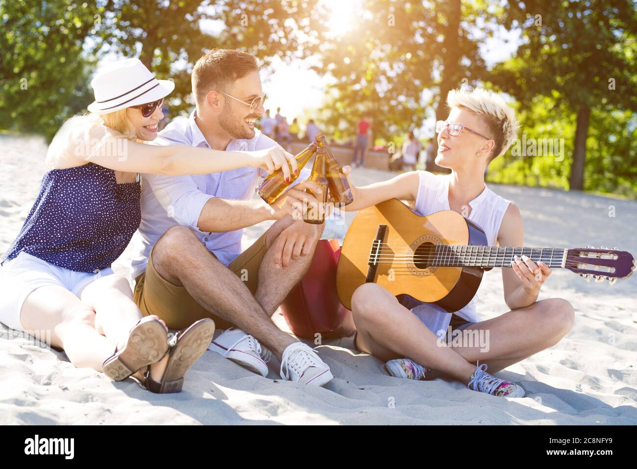 Shallow focus shot of a group of Caucasian friends having fun on a ...
