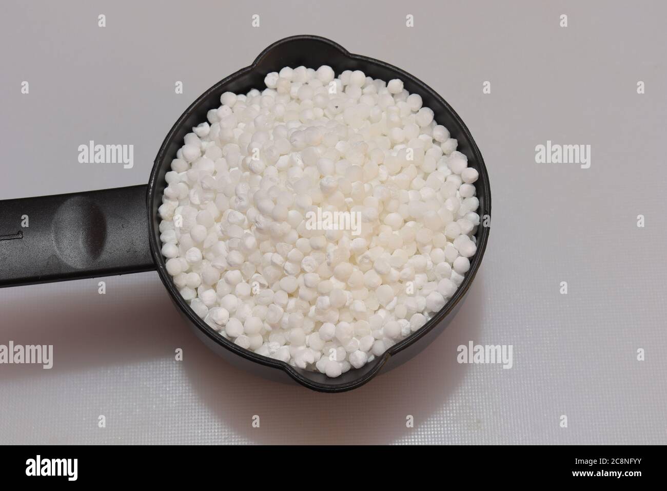 White sago pearls or sabudana Raw healthy sago balls isolated in wooden ...