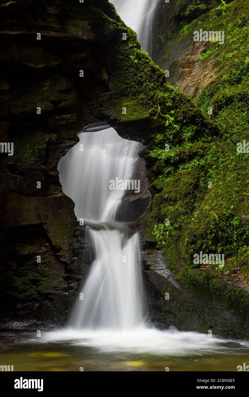 Water flows through a hole in the rock at St Nectan's waterfall Stock ...