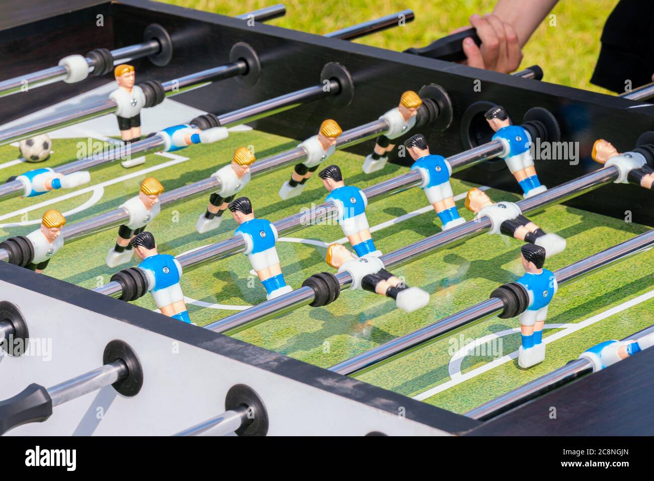 Children play table football in the yard on a sunny day Stock Photo - Alamy