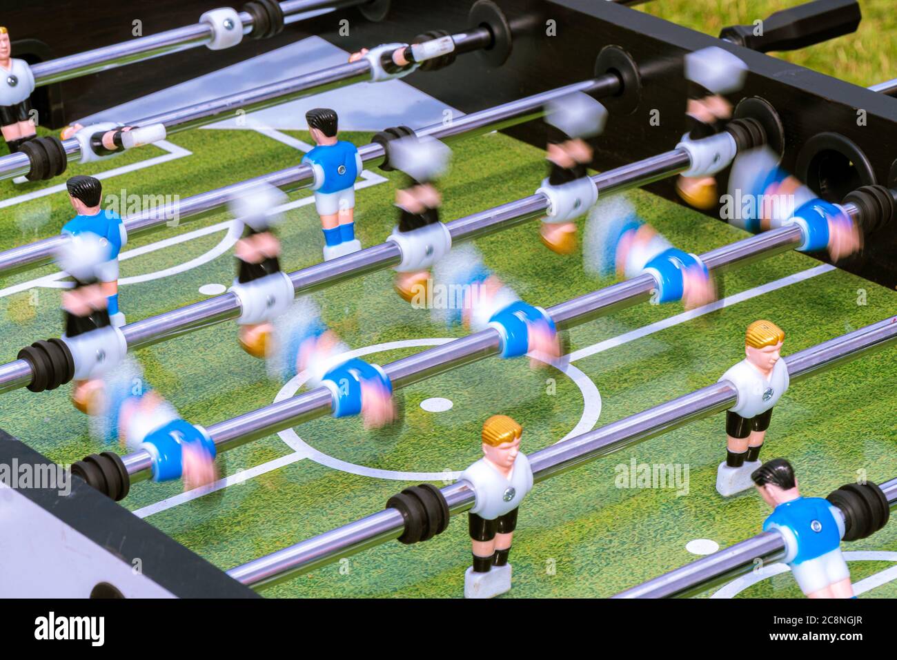 Children play table football in the yard on a sunny day Stock Photo - Alamy