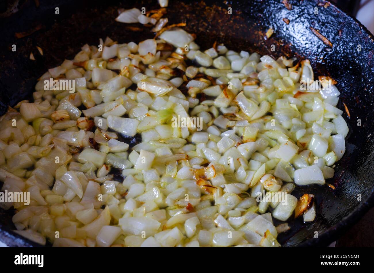 Sauteed onions in pan. Frying finely chopped onions. Simple homemade ...