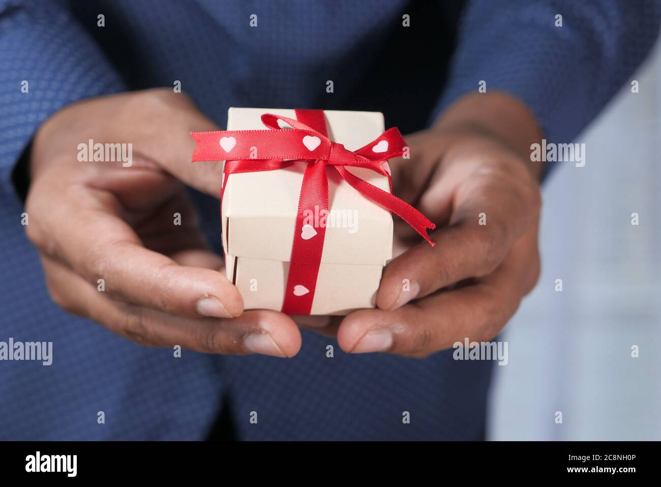 Man holding small gift box hi-res stock photography and images - Alamy