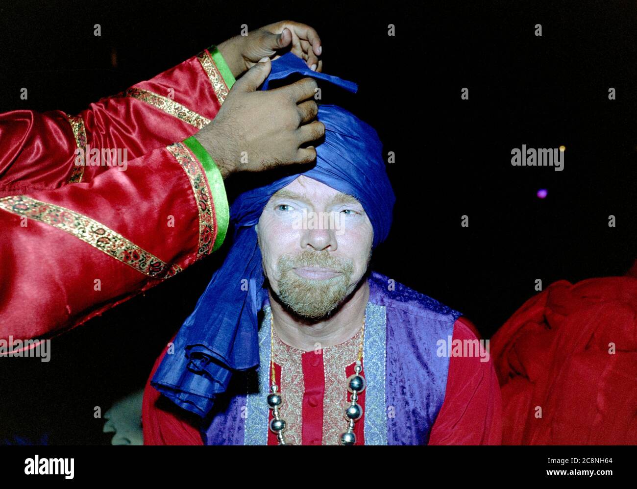 Virgin Airlines boss Sir Richard Branson enjoying the local festivities ...