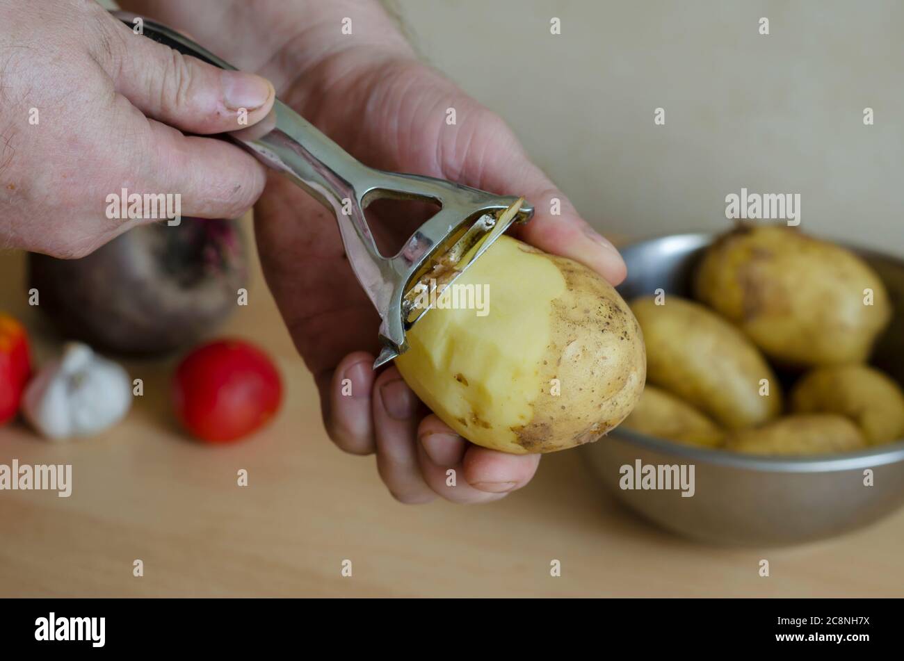 Old man peels potatoes hi-res stock photography and images - Alamy