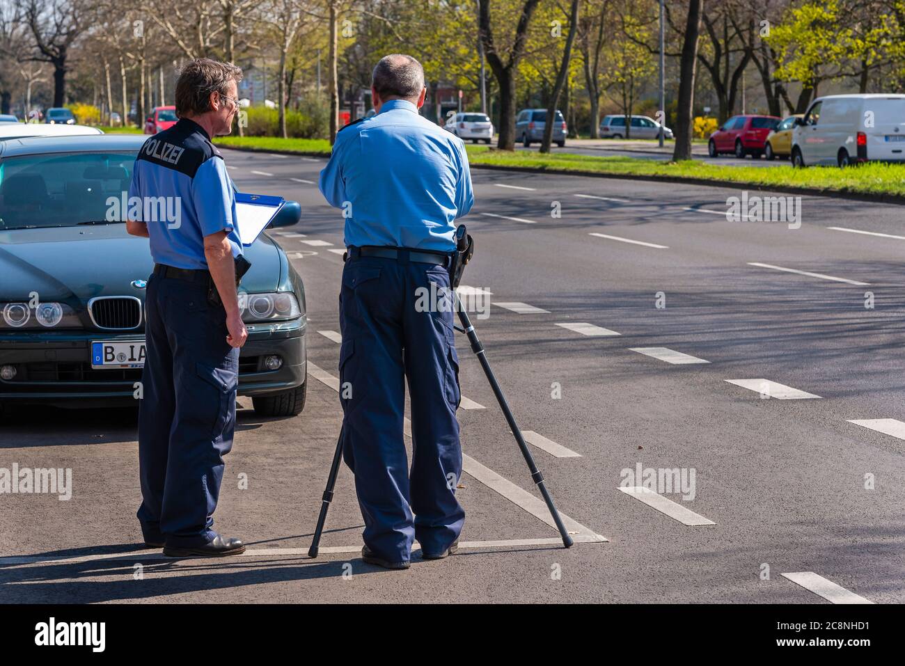 Police officers control the speed with a laser gun, speed control, two ...
