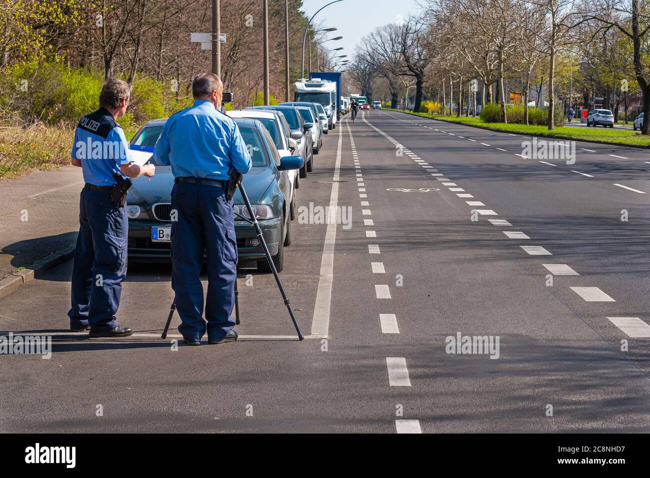 Police officers control the speed with a laser gun, speed control, two ...