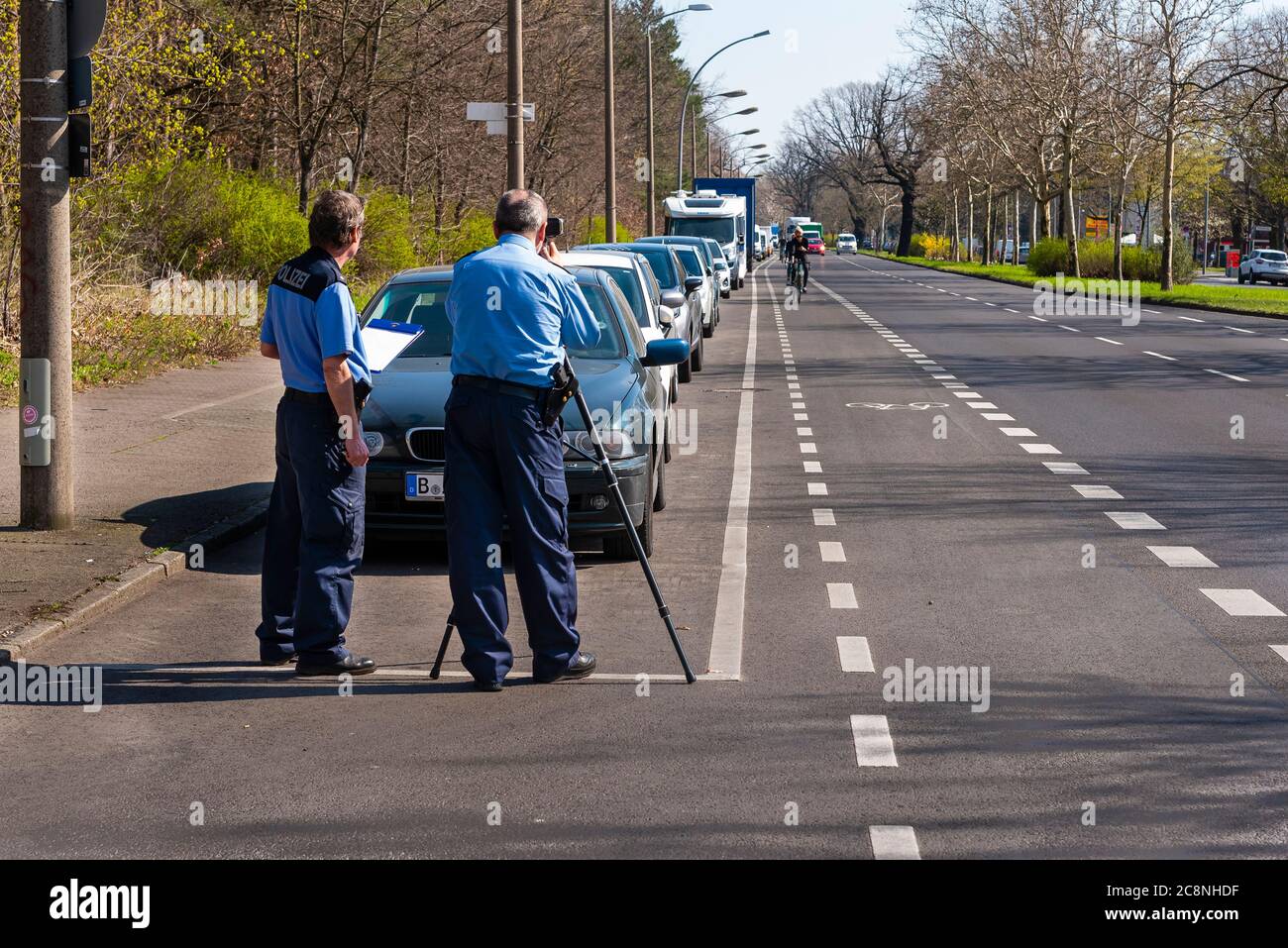 Police officers control the speed with a laser gun, speed control, two ...