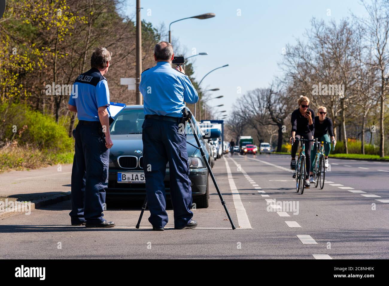 Police officers control the speed with a laser gun, speed control, two ...