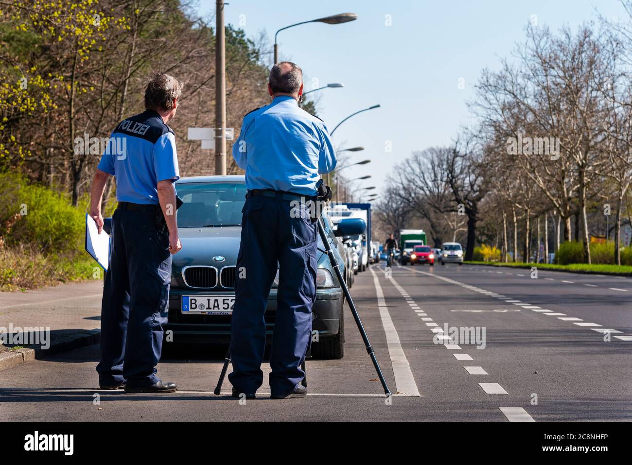 Police officers control the speed with a laser gun, speed control, two ...