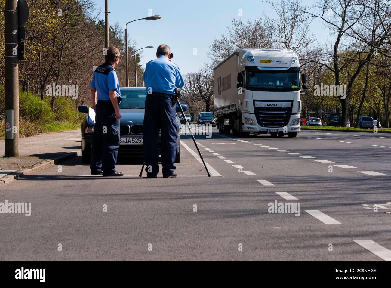 Police officers control the speed with a laser gun, speed control, two ...