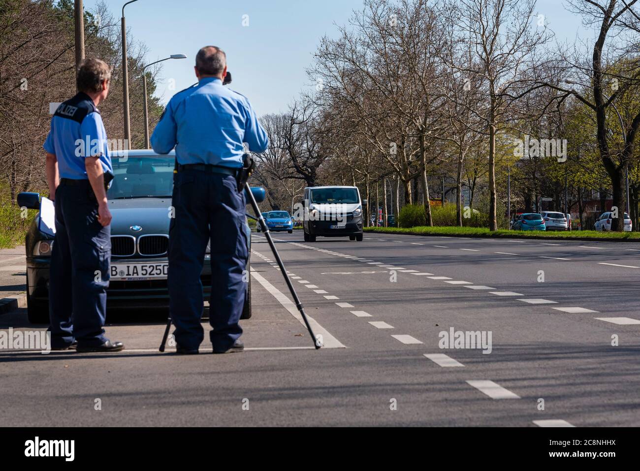 Police officers control the speed with a laser gun, speed control, two ...