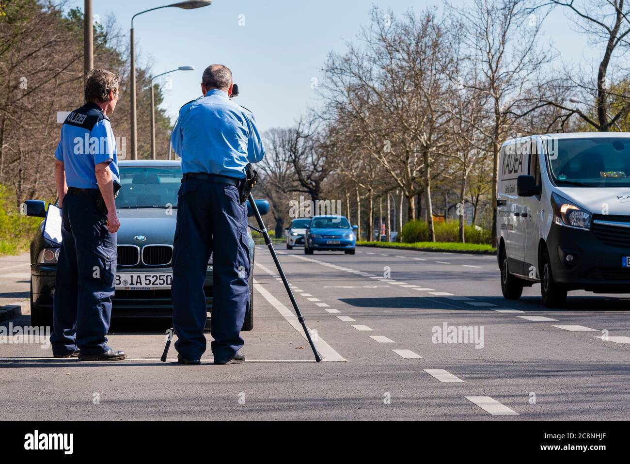 Police officers control the speed with a laser gun, speed control, two ...