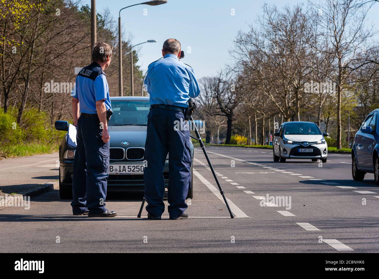 Police officers control the speed with a laser gun, speed control, two ...