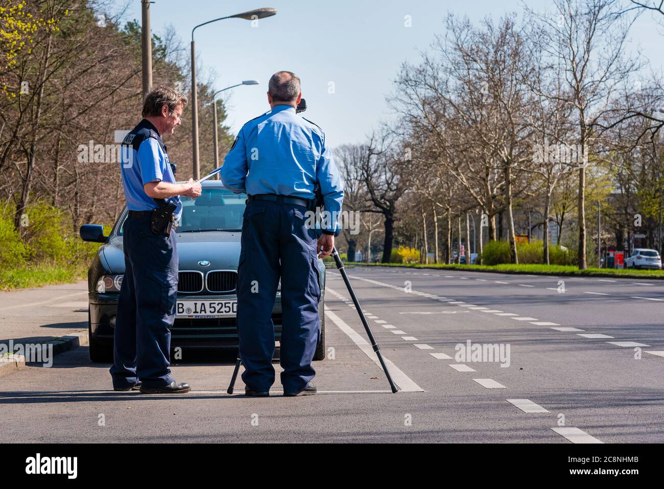 Police officers control the speed with a laser gun, speed control, two ...