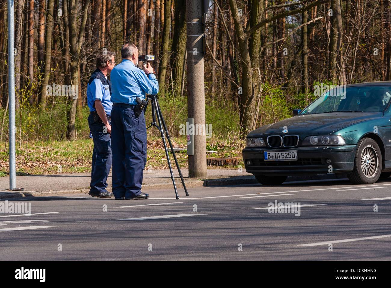 Police officers control the speed with a laser gun, speed control, two ...