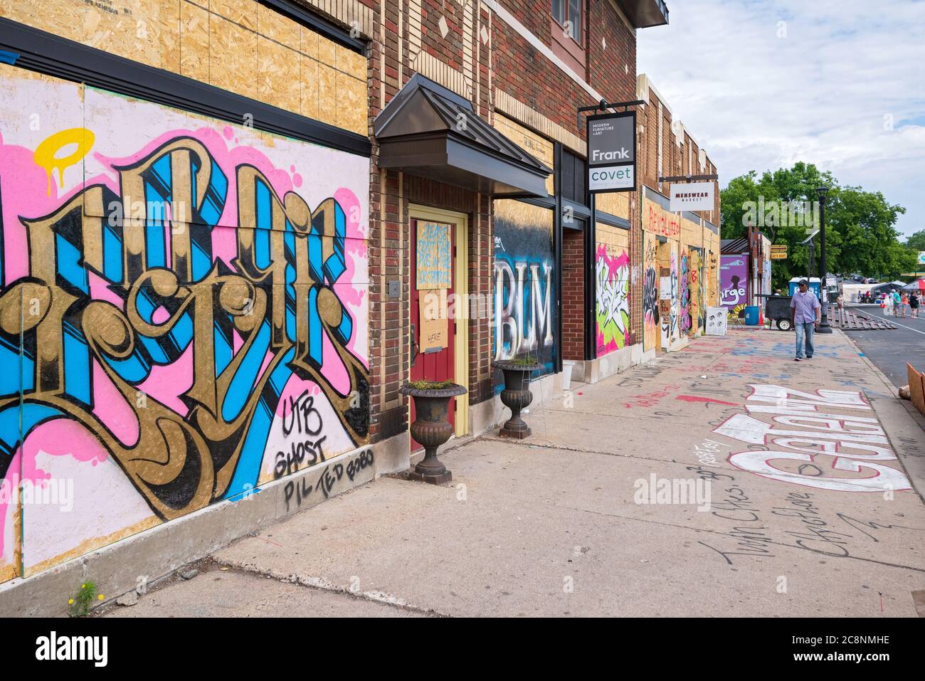 Minneapolis, MN/USA - June 21, 2020: Boarded up storefronts with ...