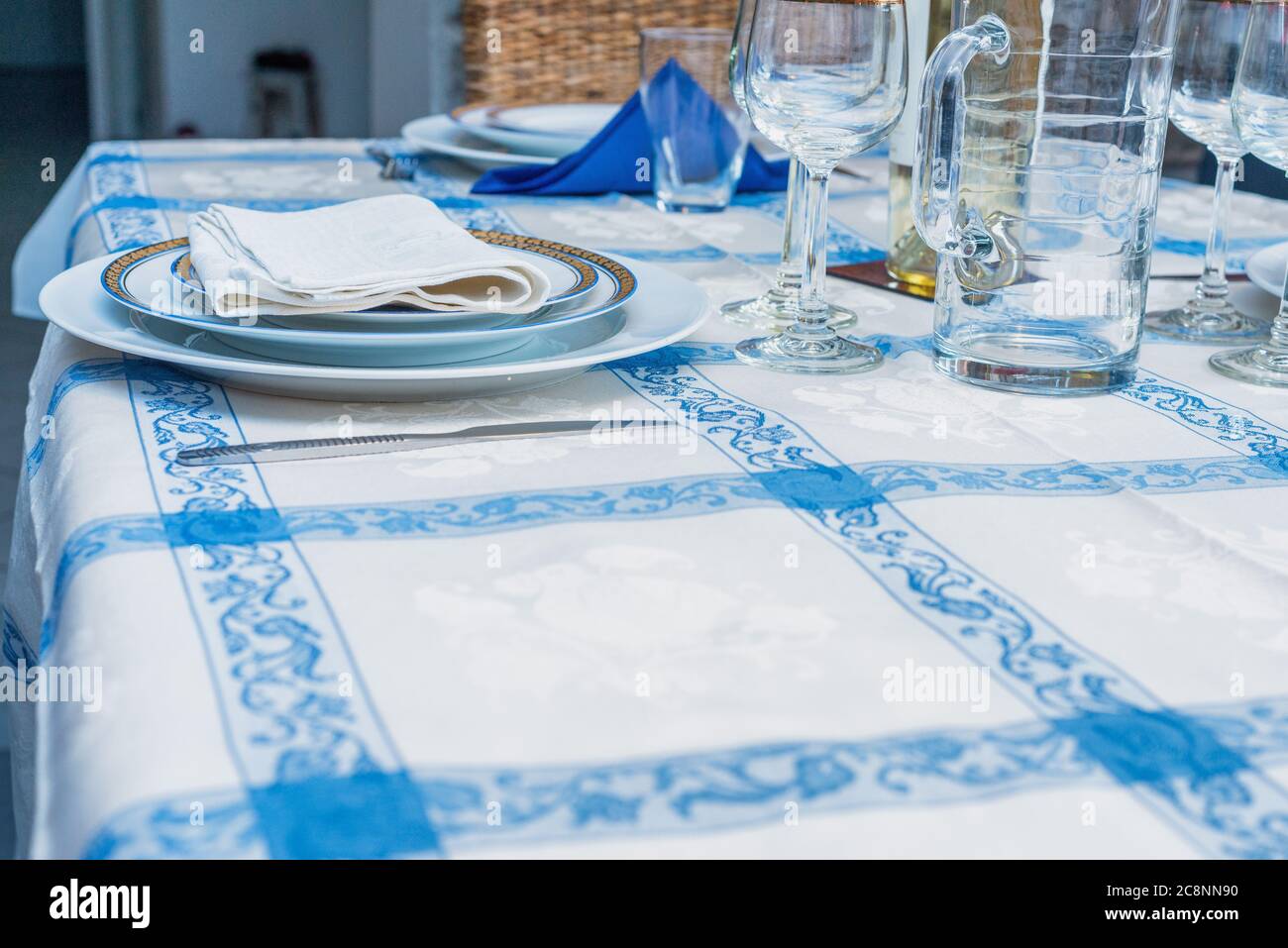 Table setting with white plates, vintage silverware, linen napkins ...