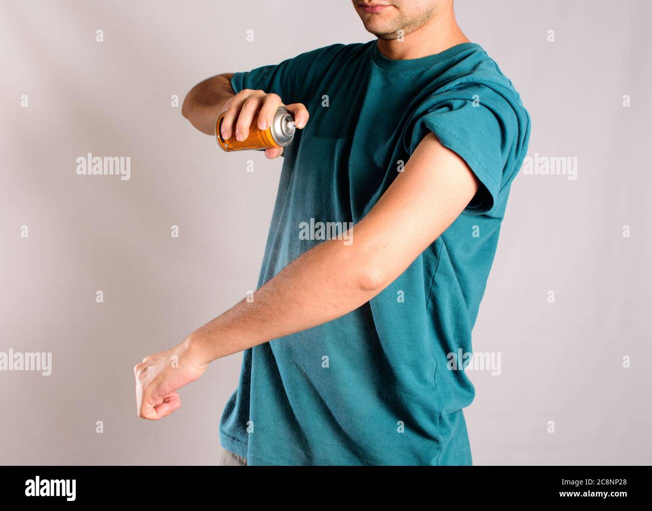 Elderly female spraying insect repellent on skin - Insect bite ...