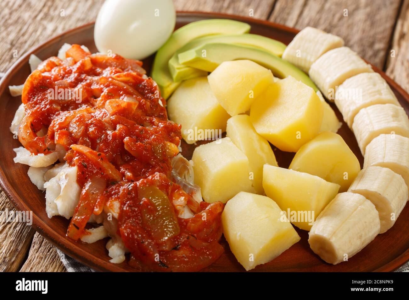 Bermuda codfish breakfast with onion tomato sauce, boiled potatoes ...