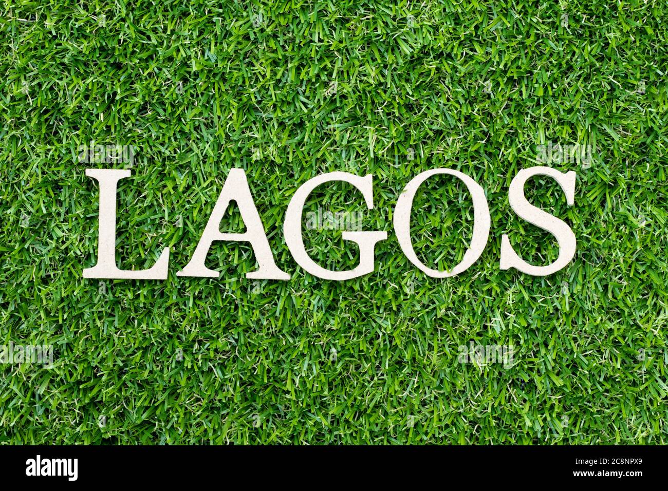 Wood alphabet letter in word Lagos on green grass background Stock ...