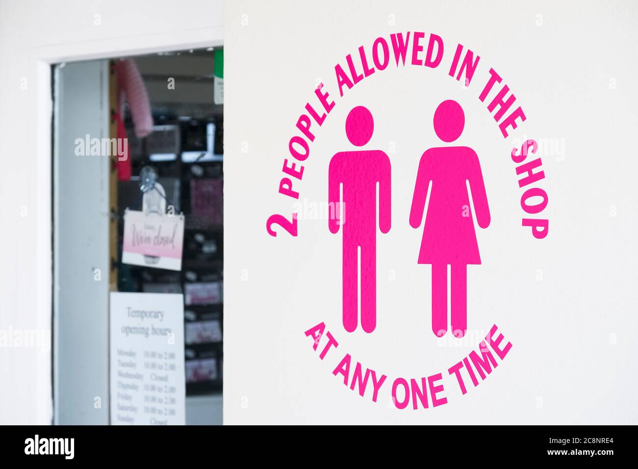 Social distancing sign for shop customer queue Stock Photo - Alamy