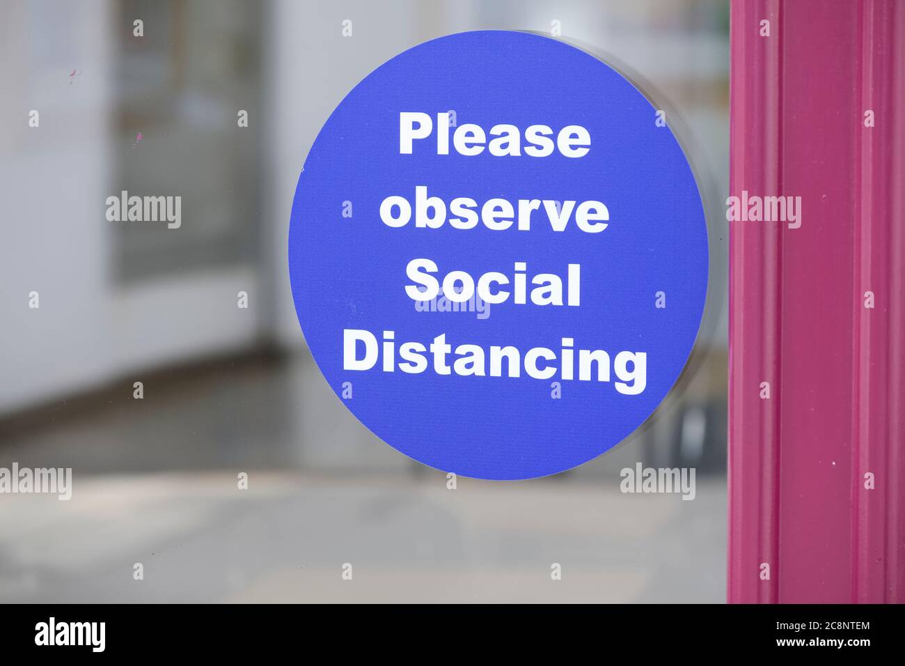 Social distancing sign for shop business customer queue Stock Photo - Alamy