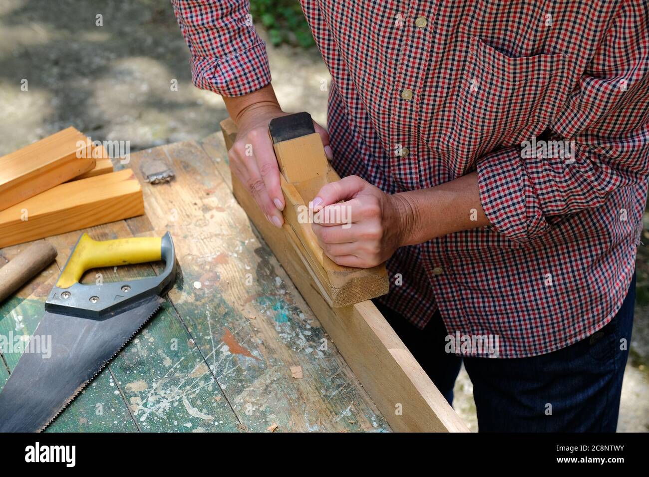 Hand of carpenter woman using planer with wooden plank in carpentry ...