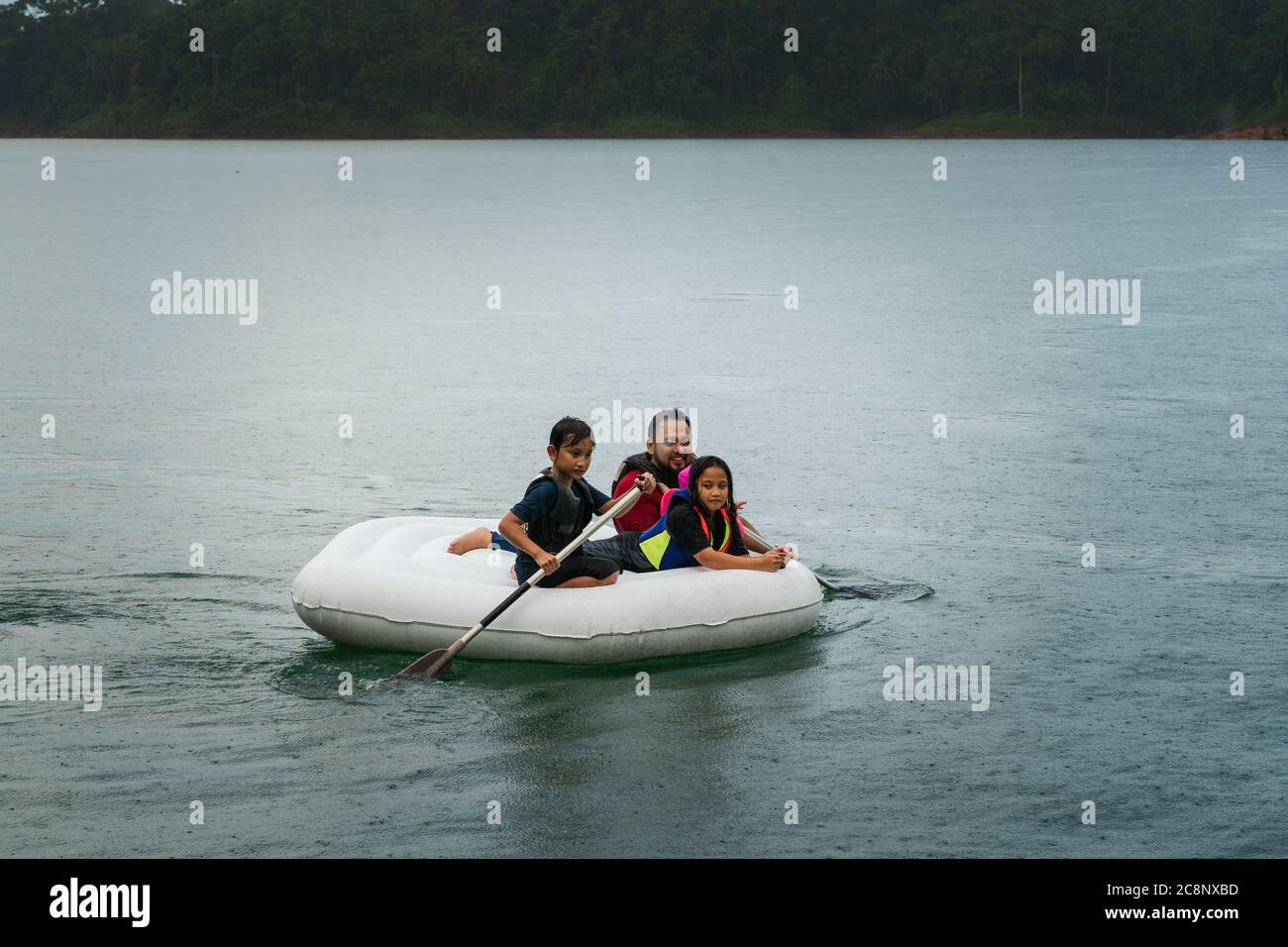 Kids in boat wearing life jackets hi-res stock photography and images ...