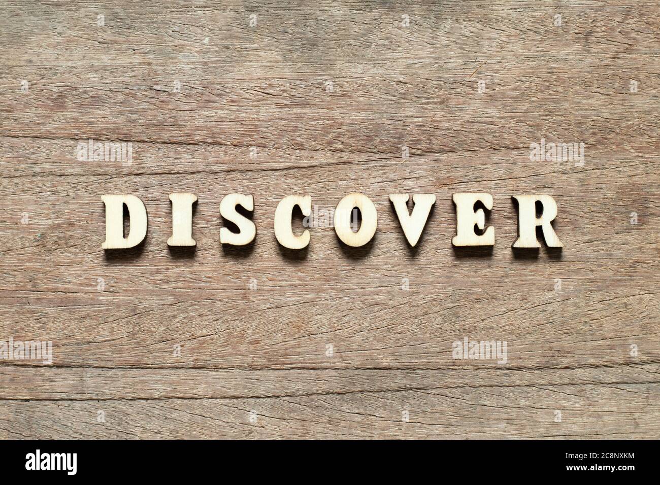 Alphabet letter block in word discover on wood background Stock Photo ...