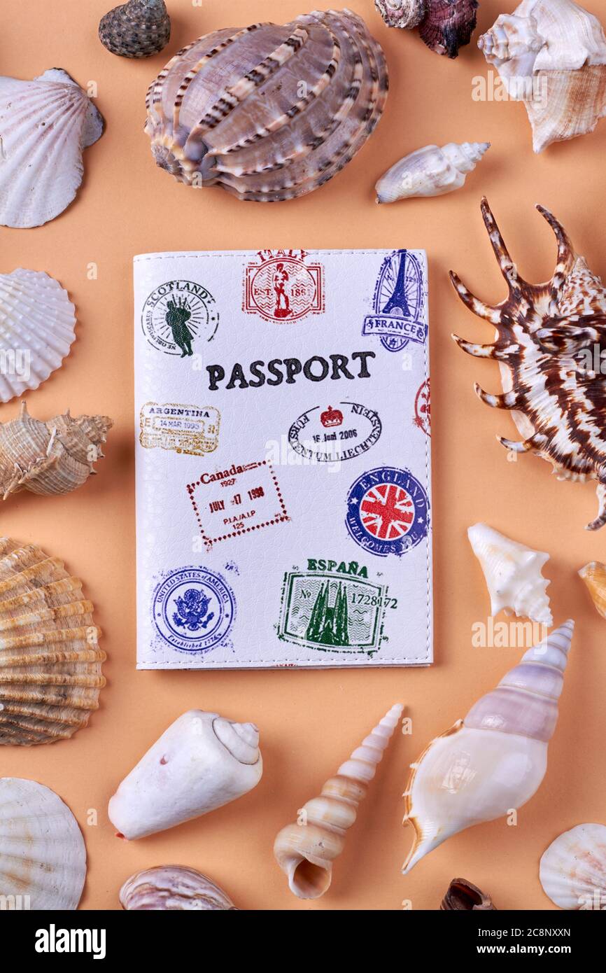Passport with stamps and various seashells Stock Photo - Alamy