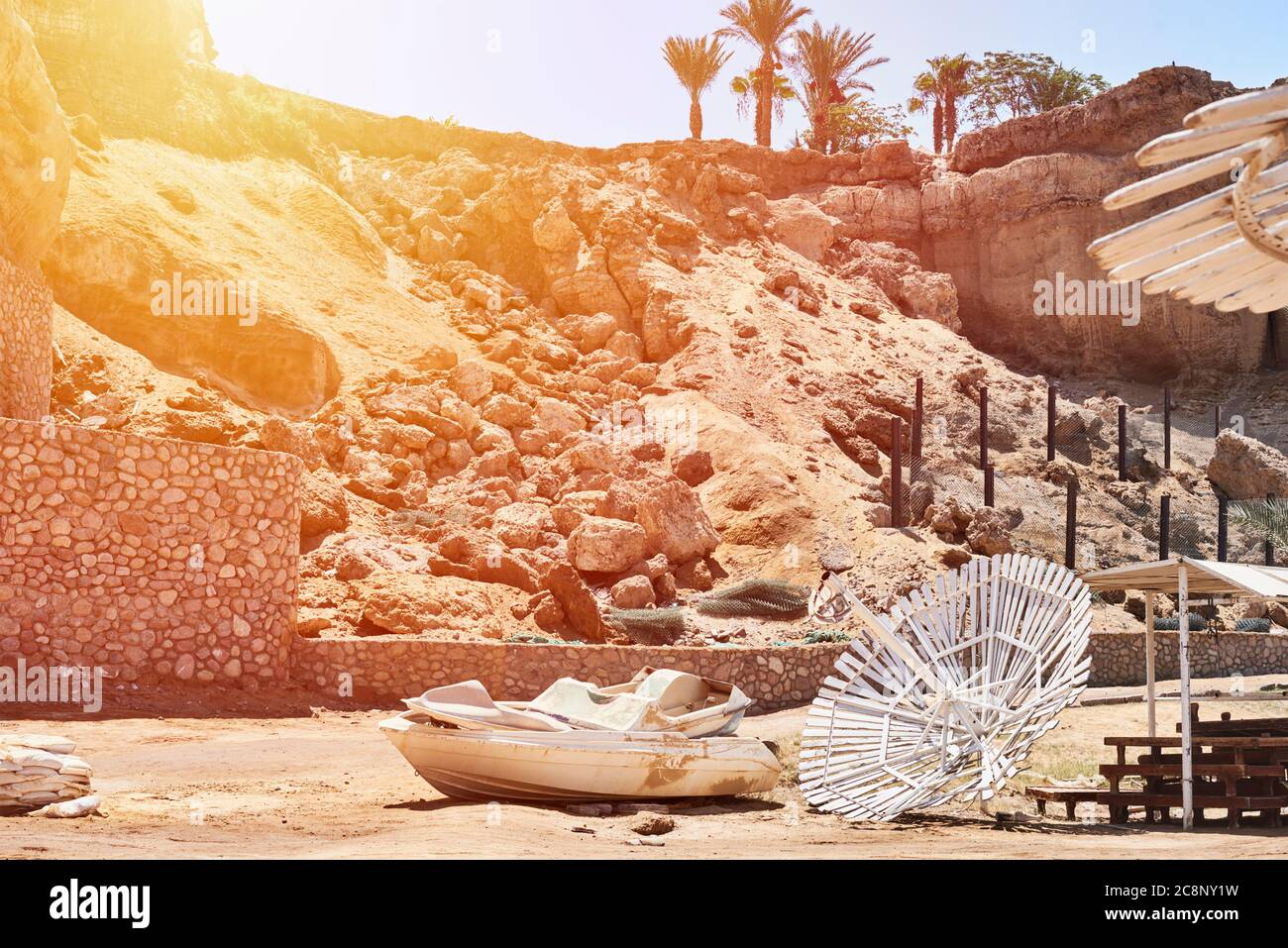 Rock collapse on beach. Collapsed rock, blocked on visiting the beach ...