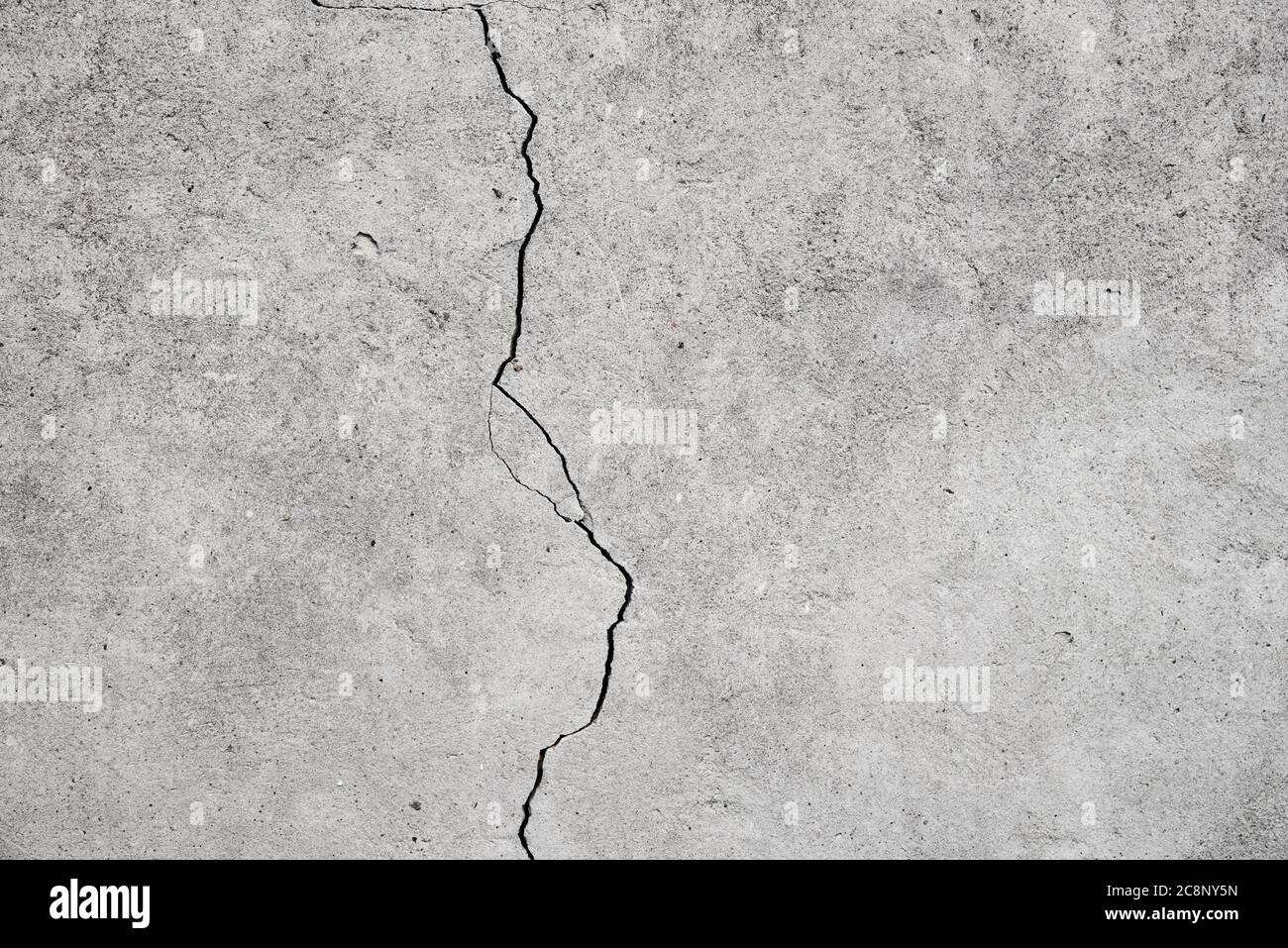 Damaged wall. Gray background with a crack Stock Photo - Alamy