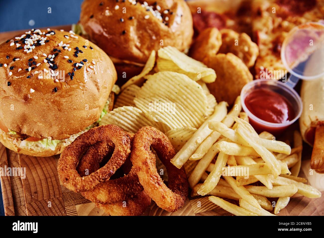 Unhealthy and junk food. Different types of fast food on the table ...