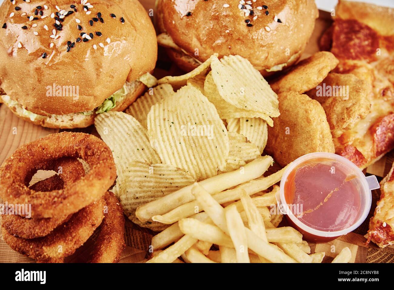 Unhealthy and junk food. Different types of fast food on the table ...