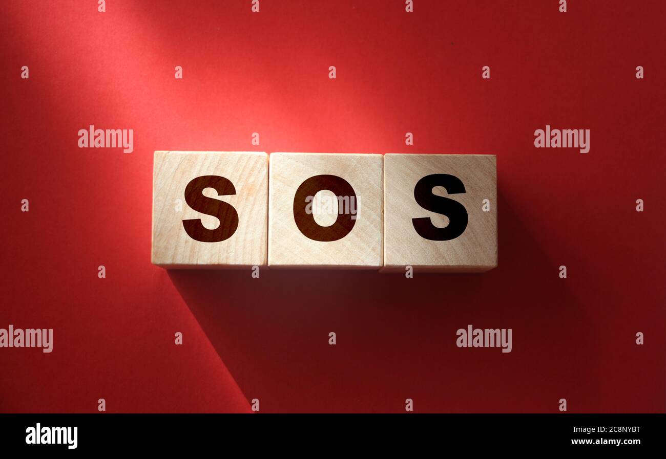 SOS symbol on wooden cubes. Save Our Souls call for help concept Stock ...
