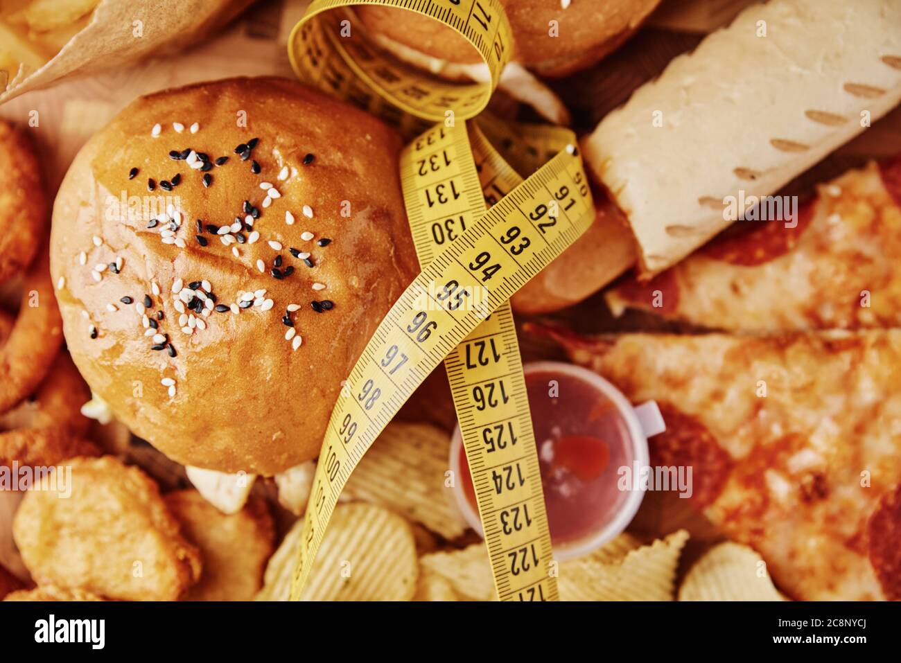 Unhealthy and junk food. Different types of fastfood and snacks on ...