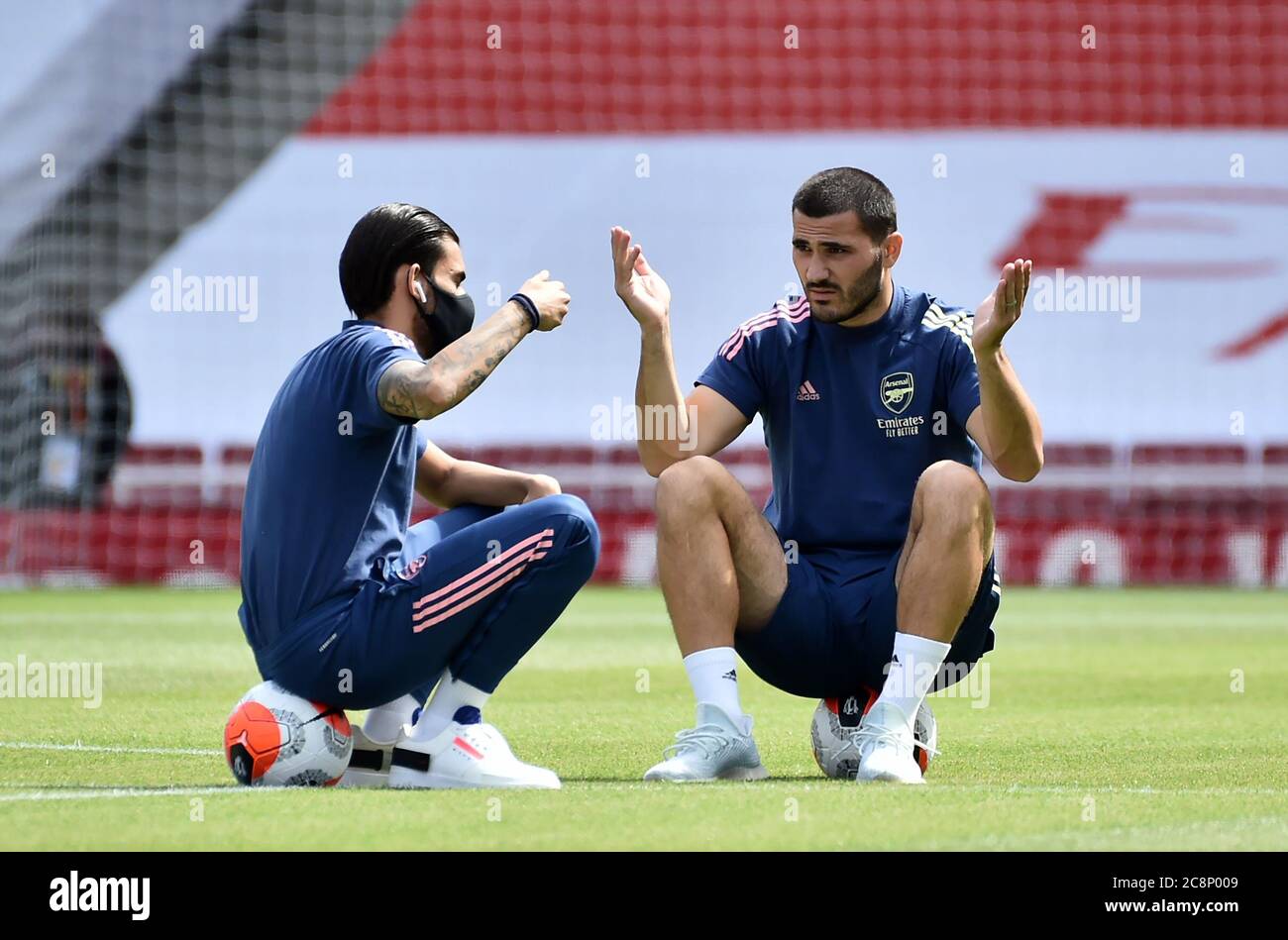 Arsenal's Dani Ceballos(left) and Sead Kolasinac speak before the ...