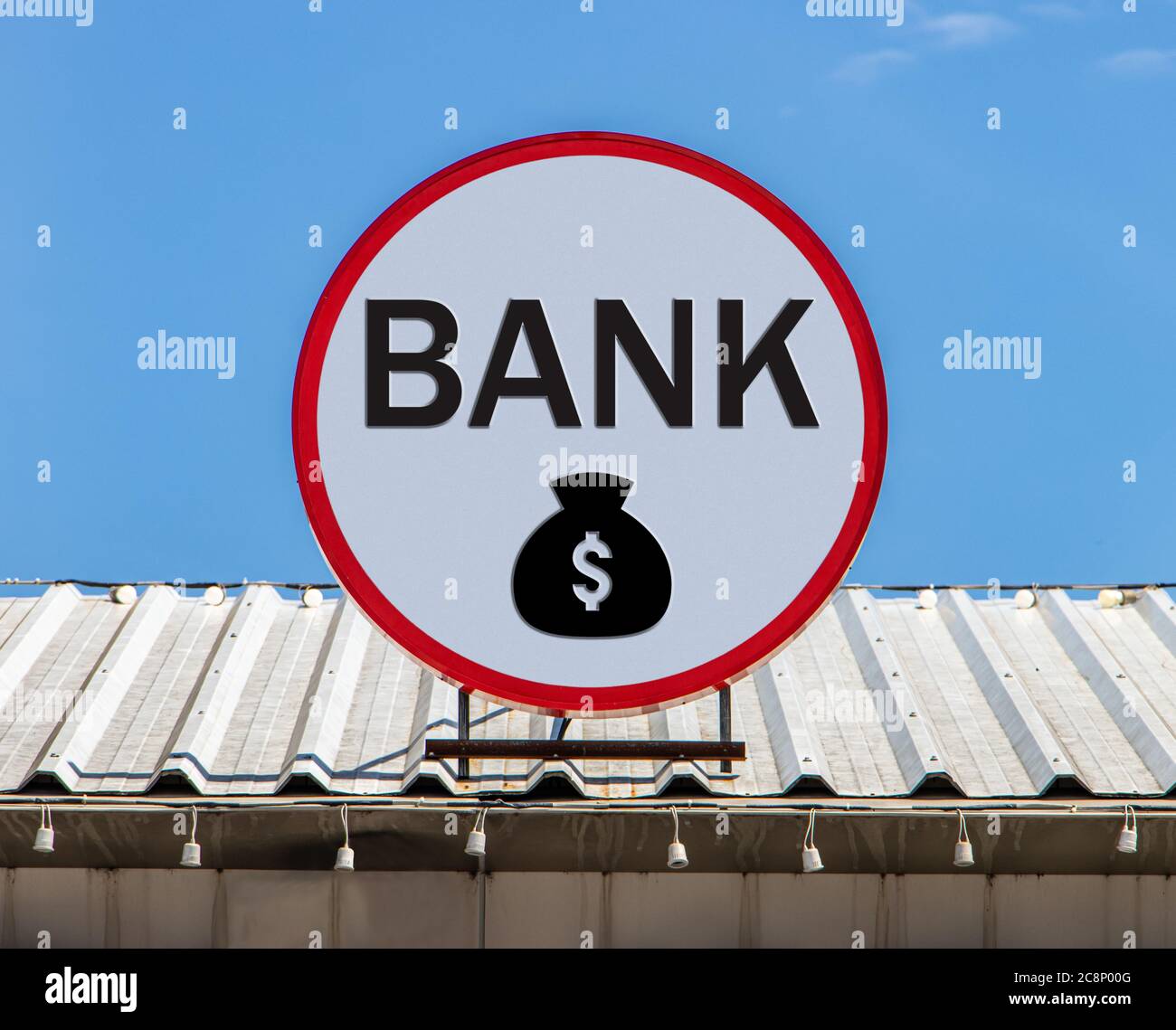 A Circle billboard with sign a Bank and money bag, is installed on a ...