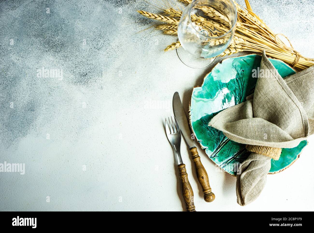 Rustic place setting on a table with wheat decoration Stock Photo - Alamy