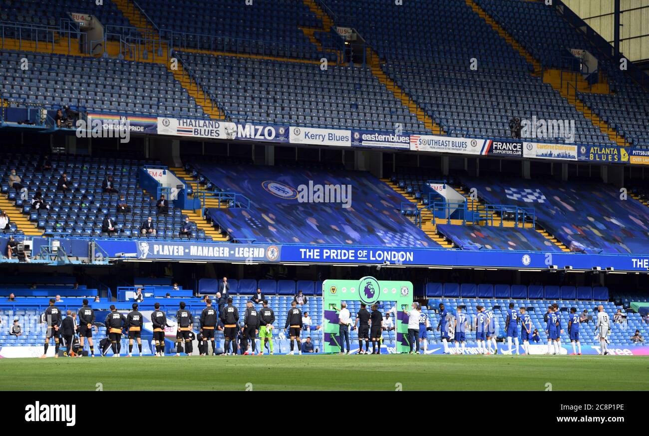 Both teams line up in front of empty stands before the Premier League ...