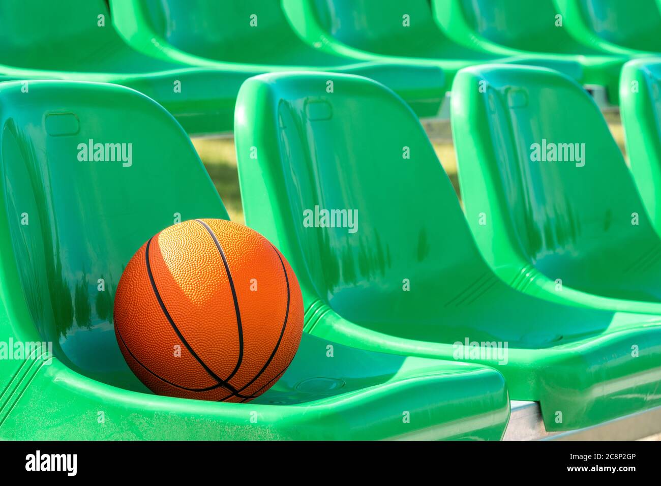 Line of stadium chairs with a basketball Stock Photo - Alamy