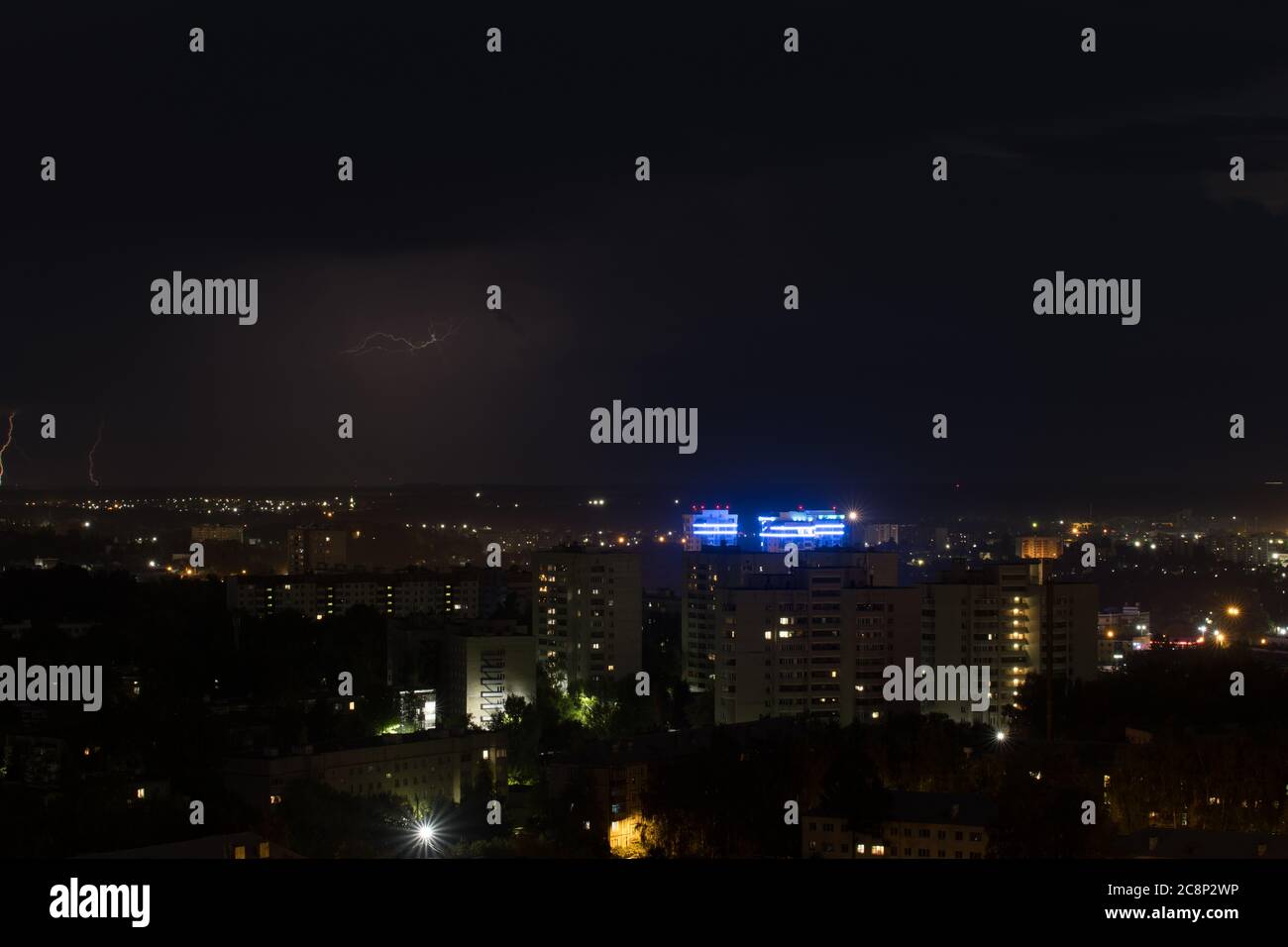 Small lightning flashes in the sky above the city. Background Stock ...