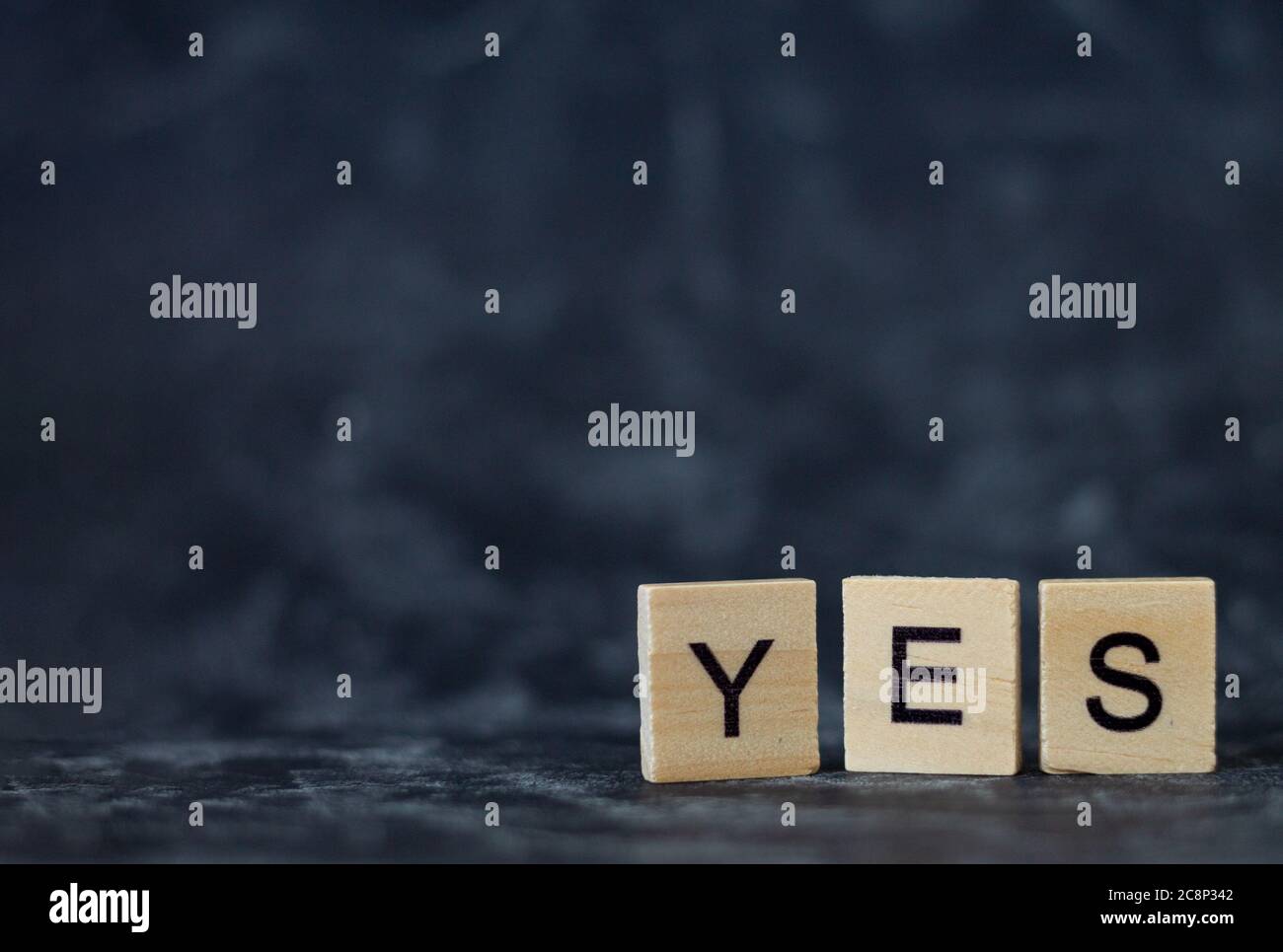 Wooden letters spelling out the word YES Stock Photo - Alamy