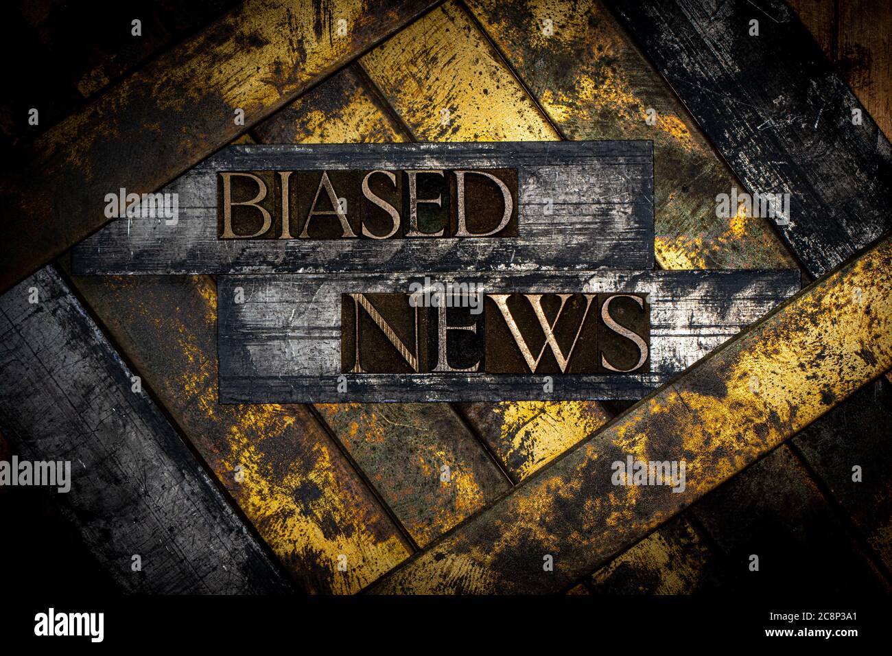 Biased News text formed with real authentic typeset letters on vintage ...